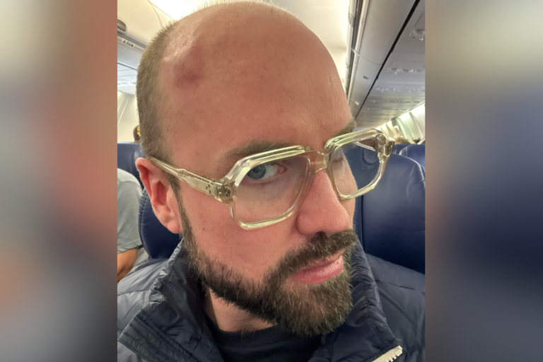Crew give man power to "turn the flight around" over what fell on his head
