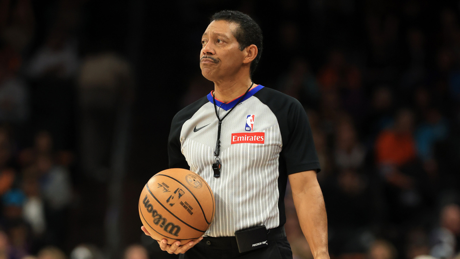 NBA referee Bill Kennedy leaves the court in a wheelchair after injury