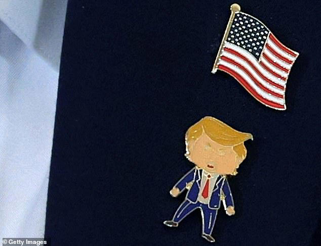 Donald Trump wears 'Happy Trump' lapel pin while meeting oil executives