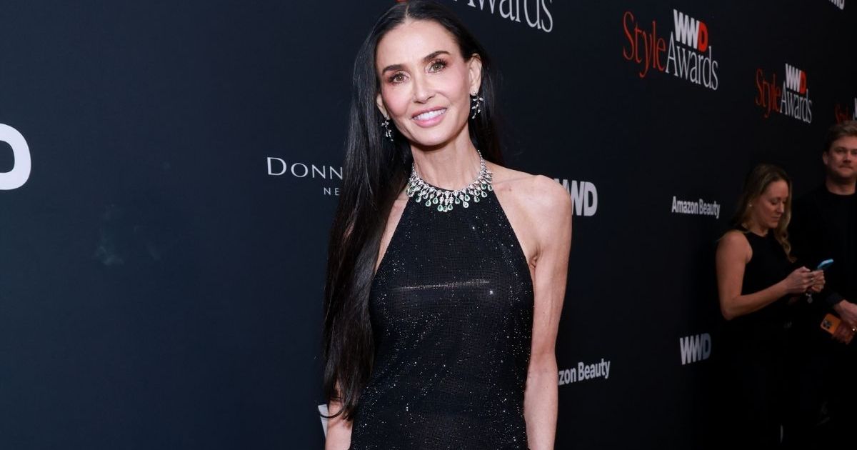 Demi Moore's subtly sheer backless Gucci dress hangs on by a string