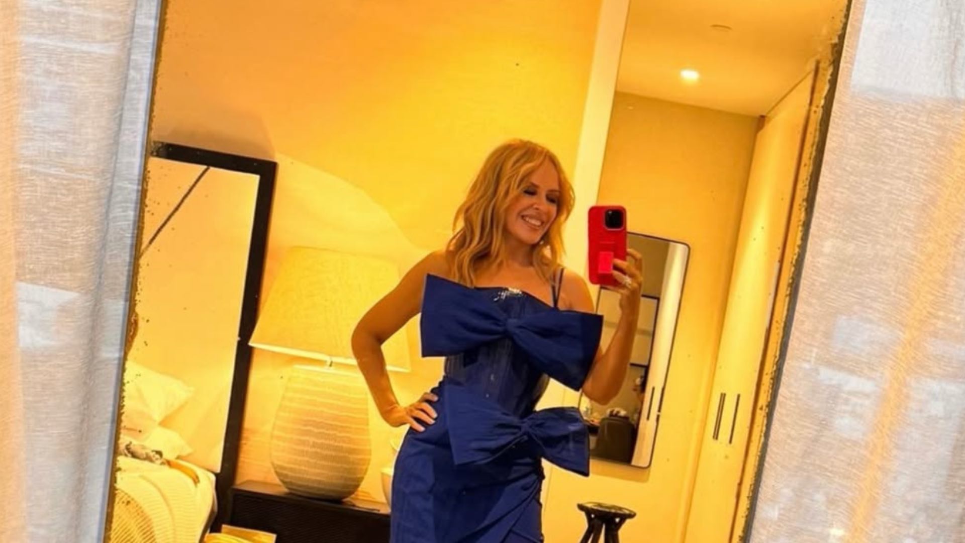 At 57, Kylie Minogue shines in a striking red dress