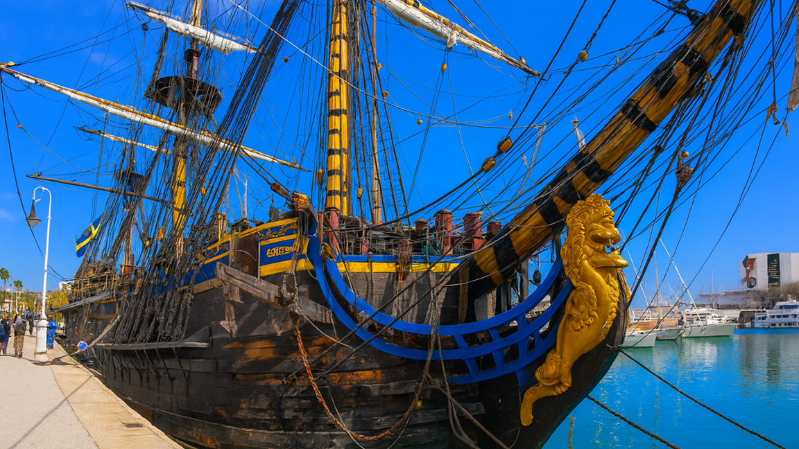 Walking past a historic tall ship in Barcelona port