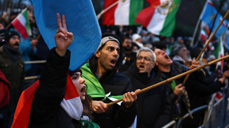 US hits Iran with new sanctions as Trump steps back from strike threats