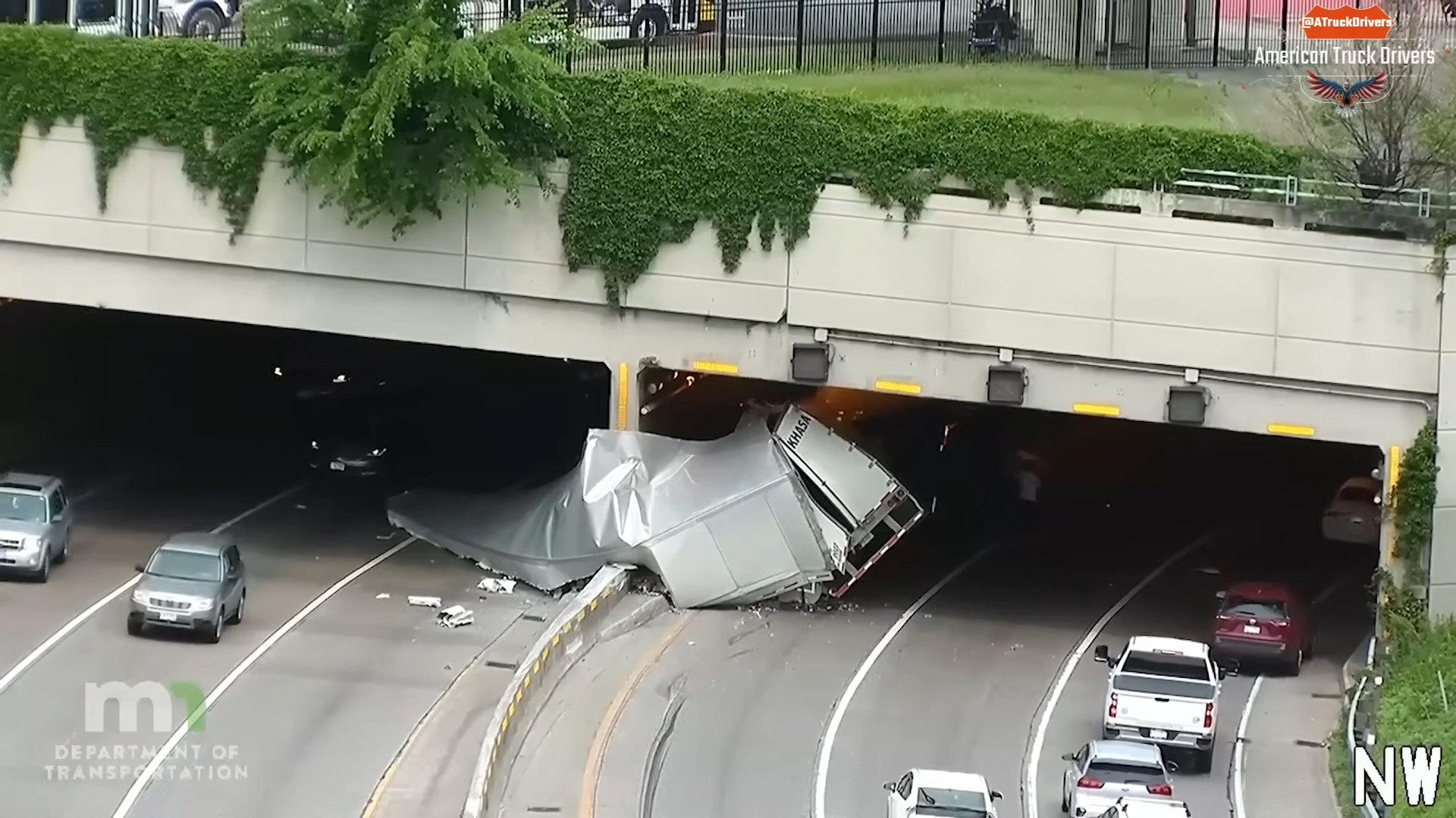 A tunnel clearance error left a semi trailer ripped open