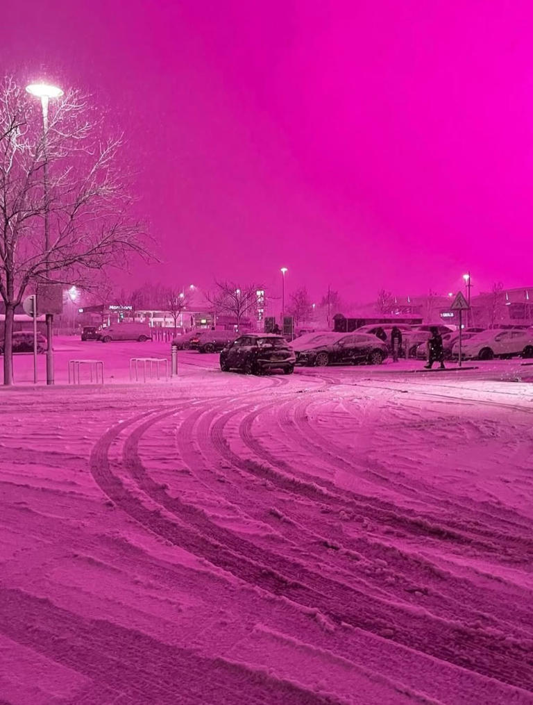 Birmingham turns pink as FA Cup stadium lights reflect off snow