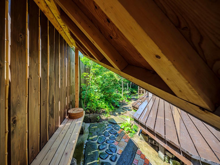Sloping earthen roof tops waiting area for Japanese tea room by ...