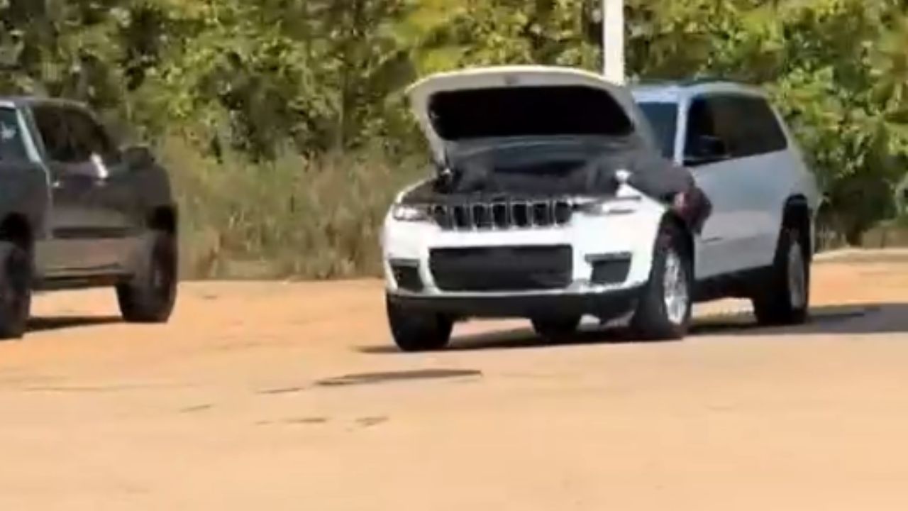 Gentleman stretches across the car front like he’s diving into the ...