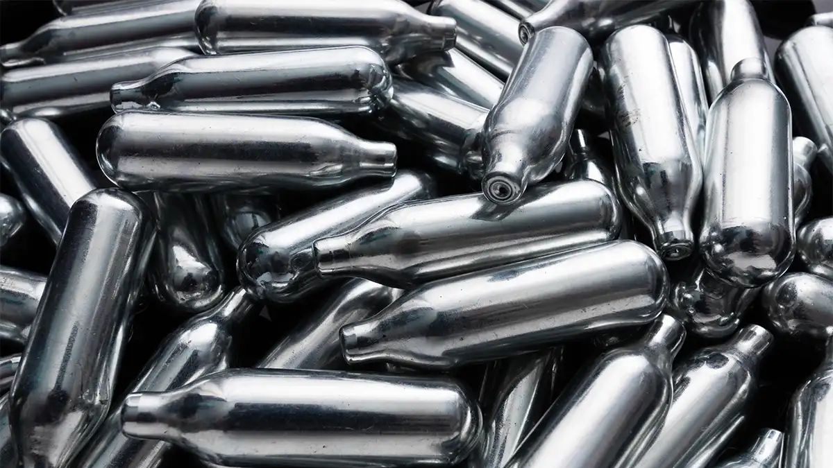 What is the chemical name and formula for laughing gas?