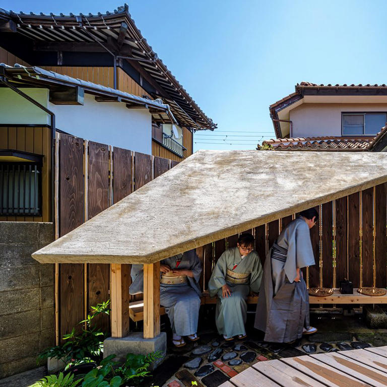 Sloping earthen roof tops waiting area for Japanese tea room by ...