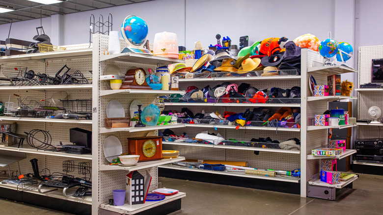 Turn an old thrift store magazine rack into adorable kitchen towel storage