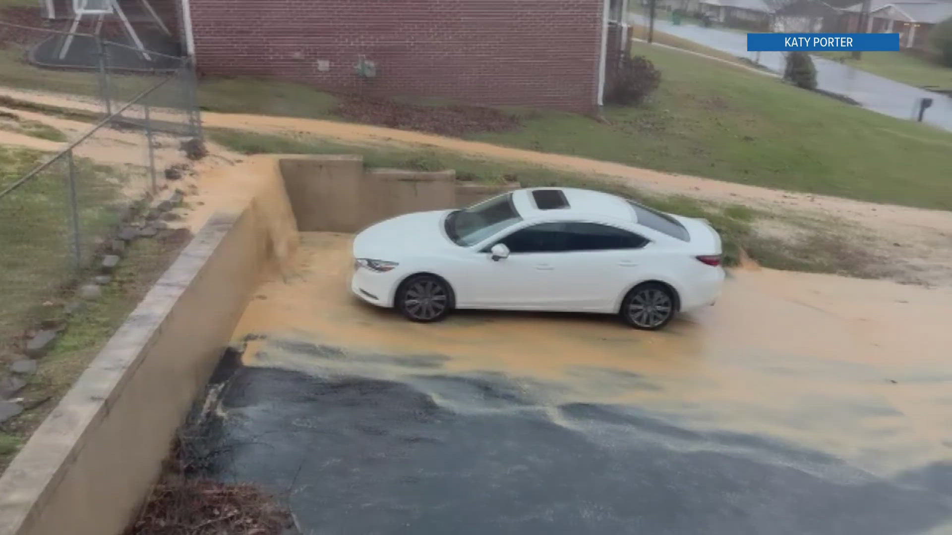Rainfall caused flooding in Powell neighborhood from a muddy ...