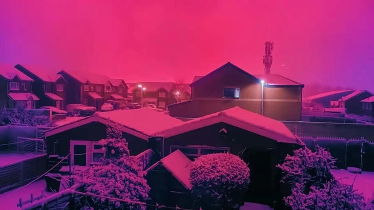 Birmingham turns pink as FA Cup stadium lights reflect off snow