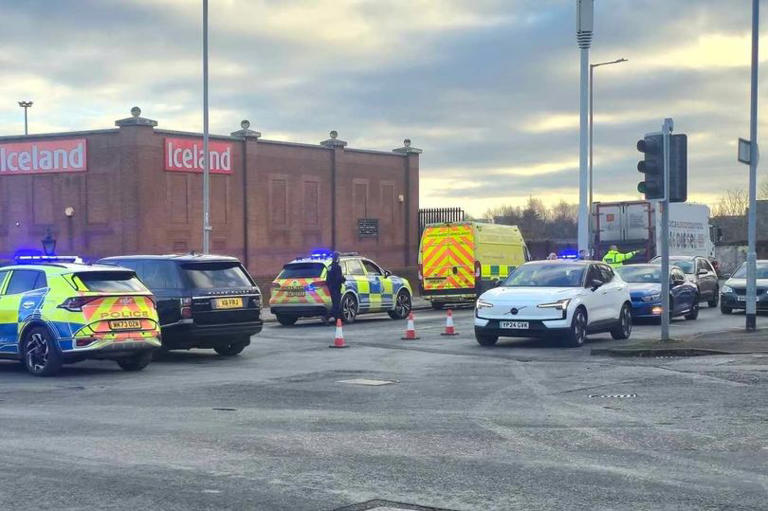 Major junction blocked after car and lorry crash