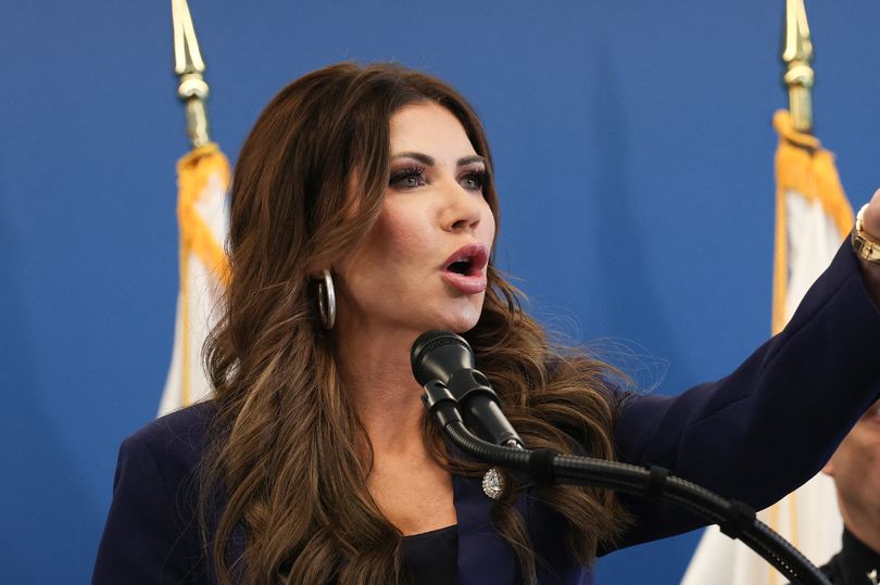 Kristi Noem hides face under massive 'stupid' cowboy hat as she gives ...