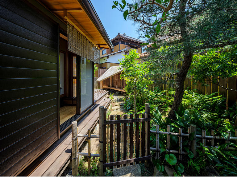 Sloping earthen roof tops waiting area for Japanese tea room by ...