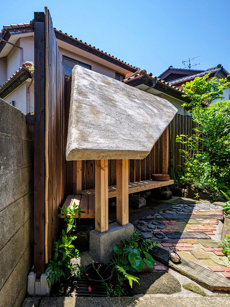 Sloping earthen roof tops waiting area for Japanese tea room by ...