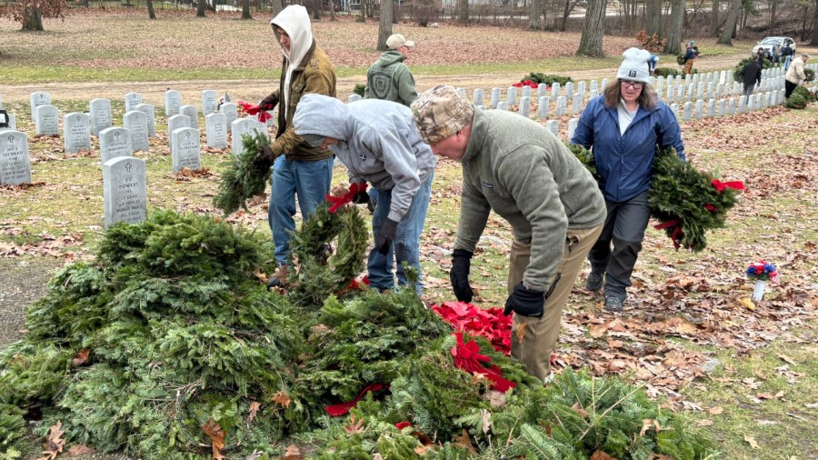 Dozens volunteer to clean up Grand Rapids veterans’ cemetery