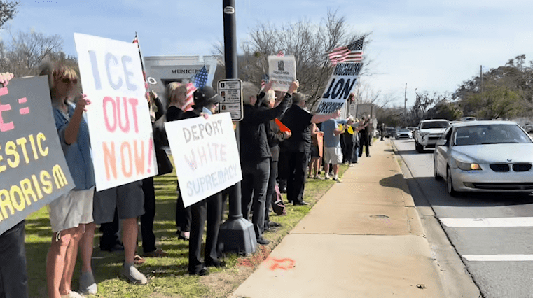 Dozens march down Forsyth Park to protest against ICE