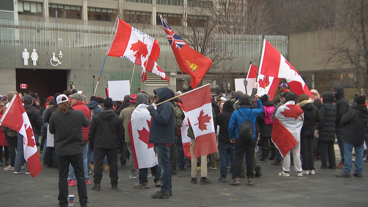 Hundreds gather for anti-immigration rally, counter-protest in downtown ...