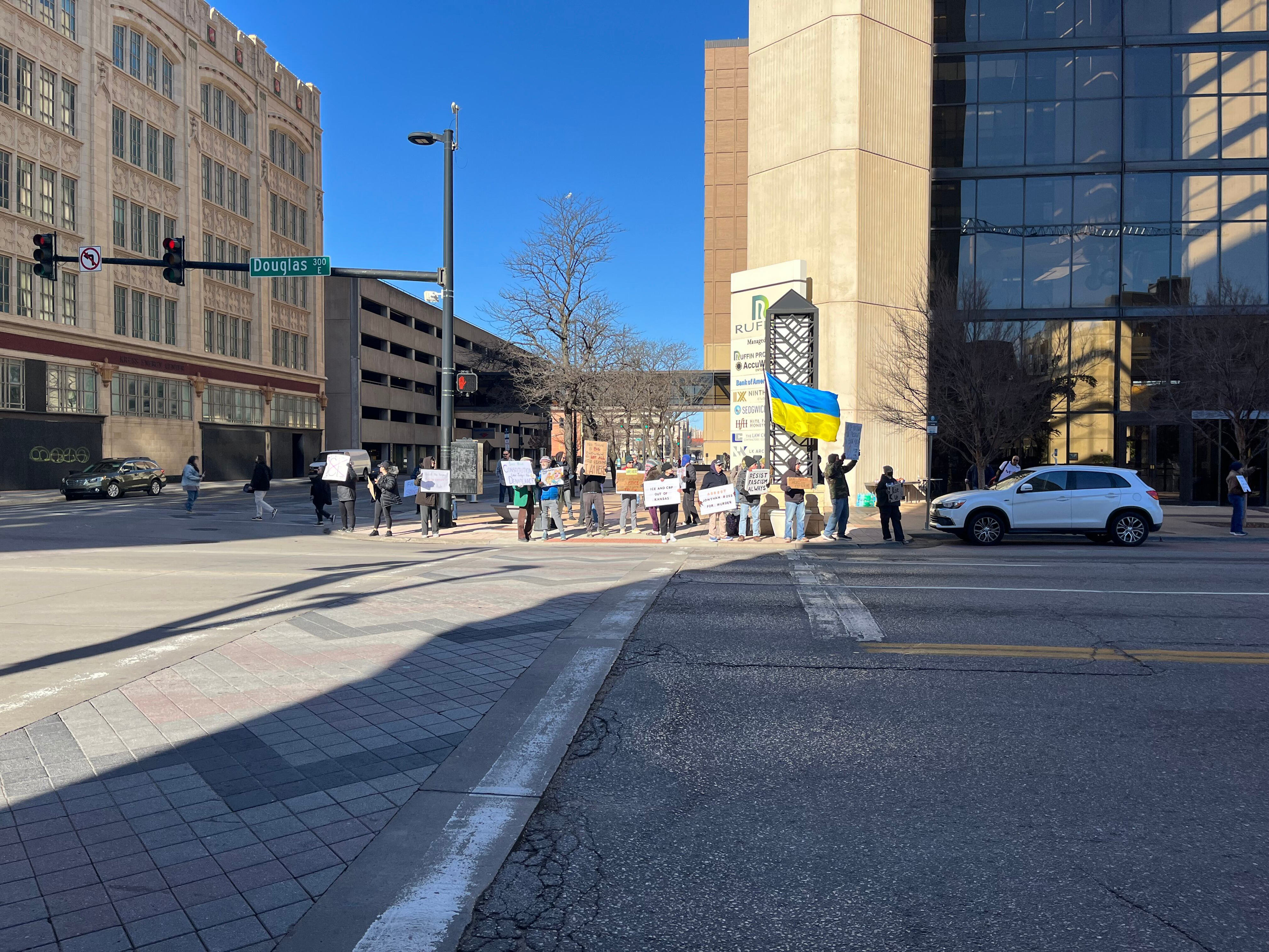 Dozens gather to protest ICE, Trump in downtown Wichita