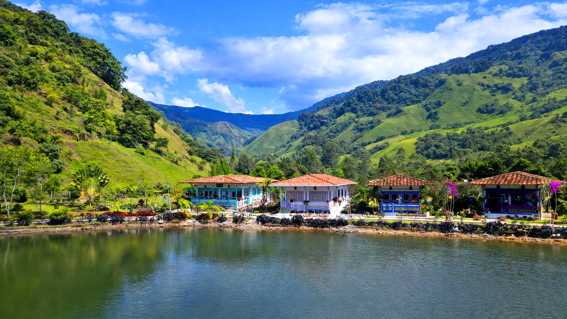 Traditional homes by a pond in Jardín, Colombia