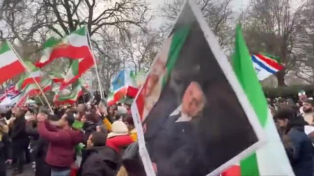Protester tears down Iranian flag from London embassy