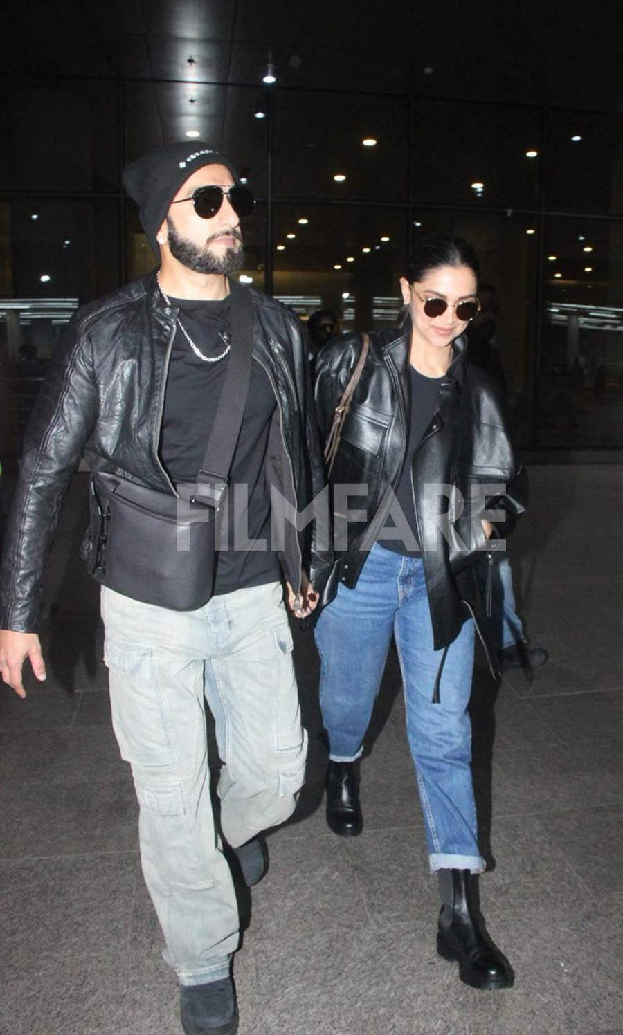 Ranveer Singh and Deepika Padukone turn heads as they arrive back in Mumbai