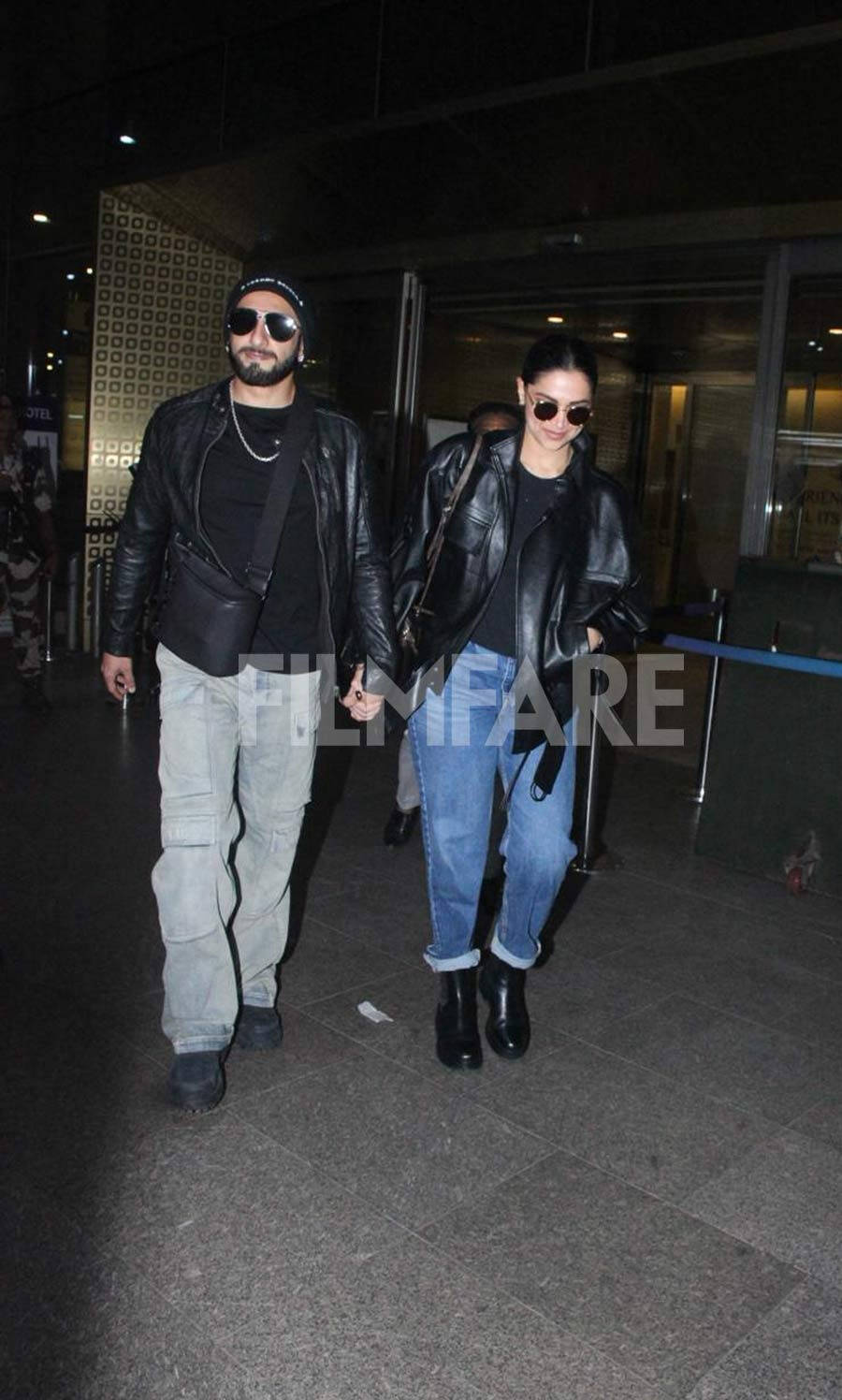 Ranveer Singh and Deepika Padukone turn heads as they arrive back in Mumbai