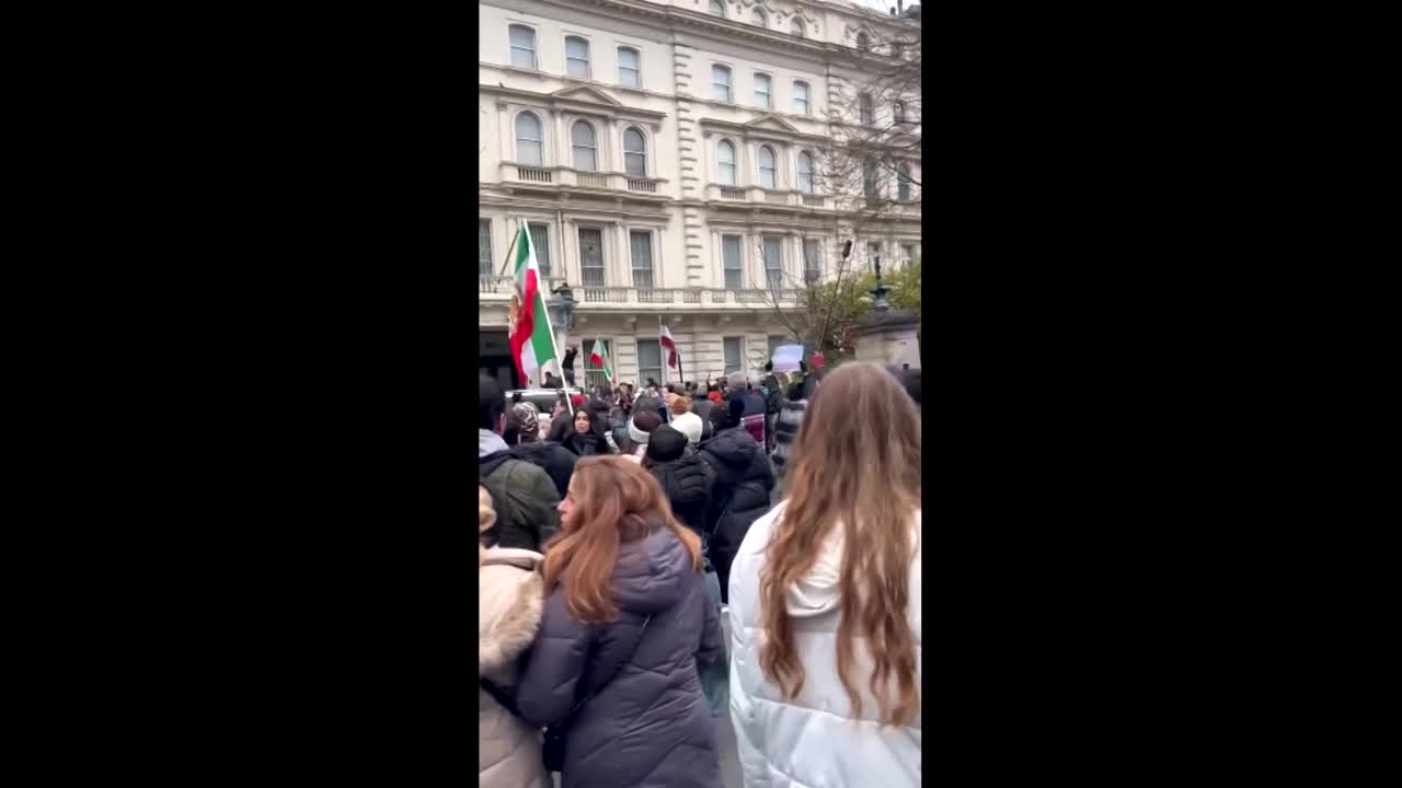 Protester raises pre-revolution flag from Iran's London embassy