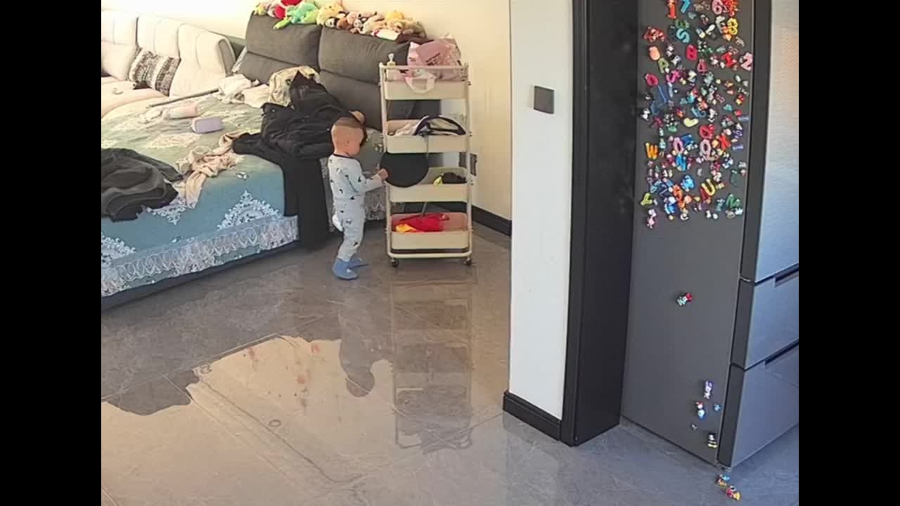 Curious child hits wall while wearing police hat in Liaoning, China