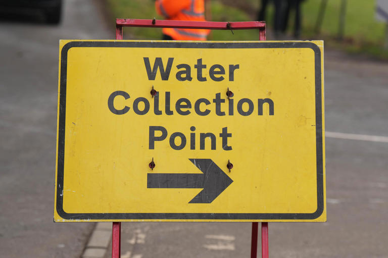 In photos: cars queue at bottled water station in East Grinstead as ...