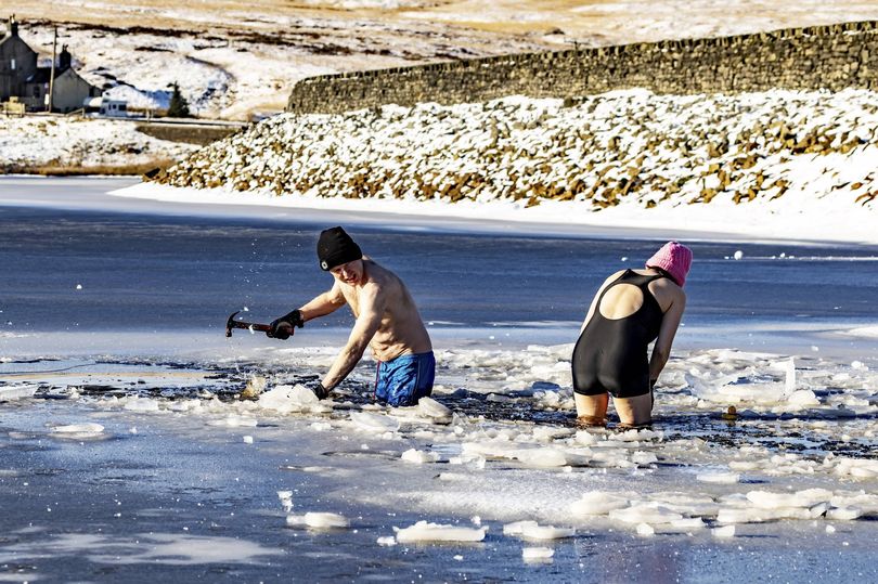 Wild swimmers hammer through ice at Huddersfield reservoir for a -2C dip