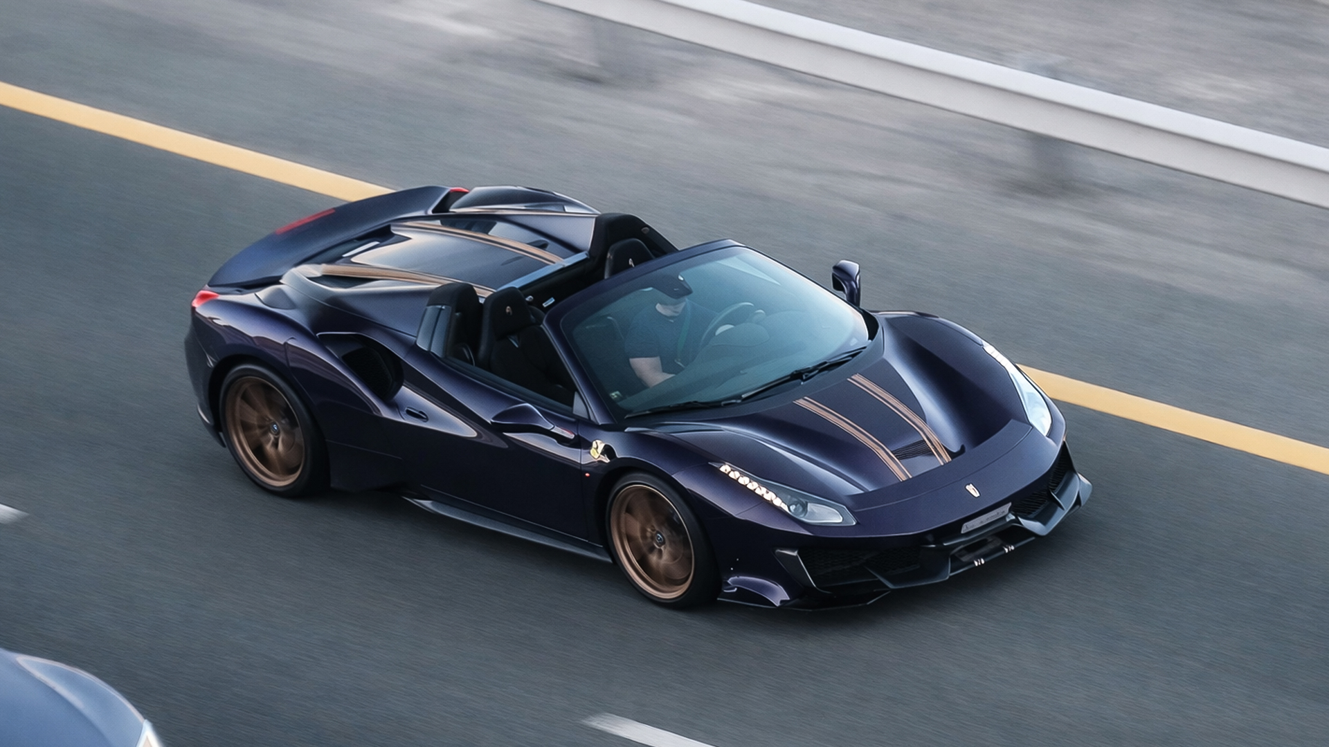 Ferrari 488 Spider rolls through Dubai traffic