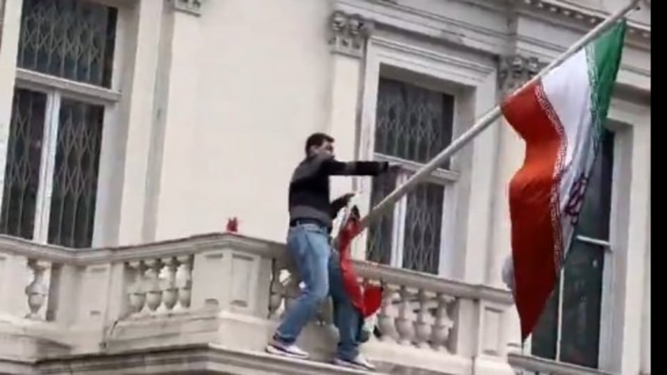 Iran protest reaches London, protesters climb embassy wall, remove ...