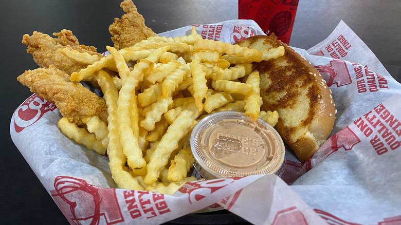 What does Raising Cane's do with leftover food?