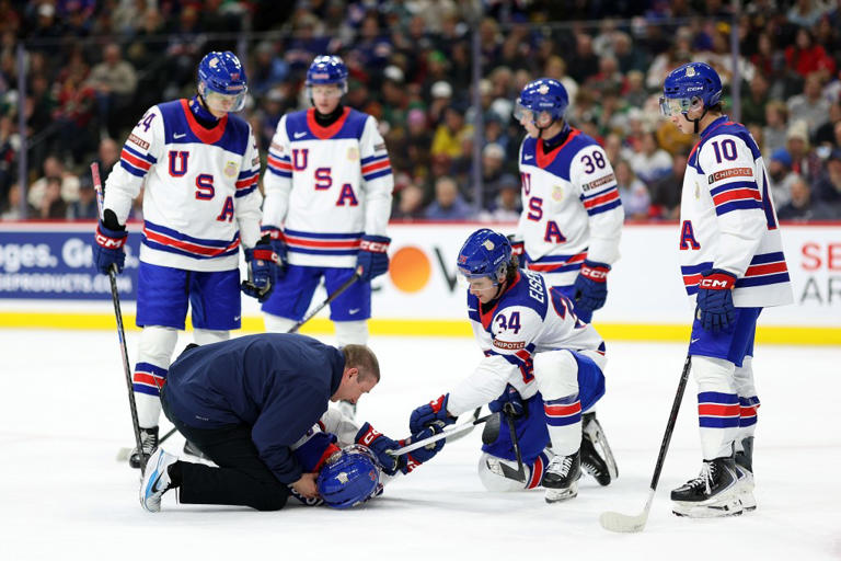 USA’s Cole Hutson stretchered off ice, taken to hospital after getting ...