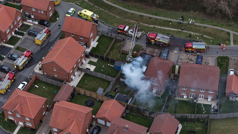 Neighbours battle to put out fire engulfing home