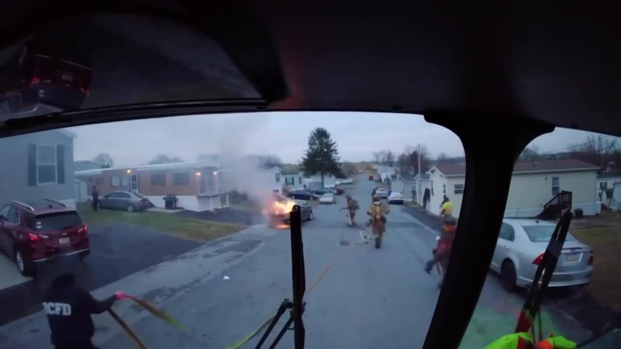 Firefighters extinguish engine compartment fire at mobile home park