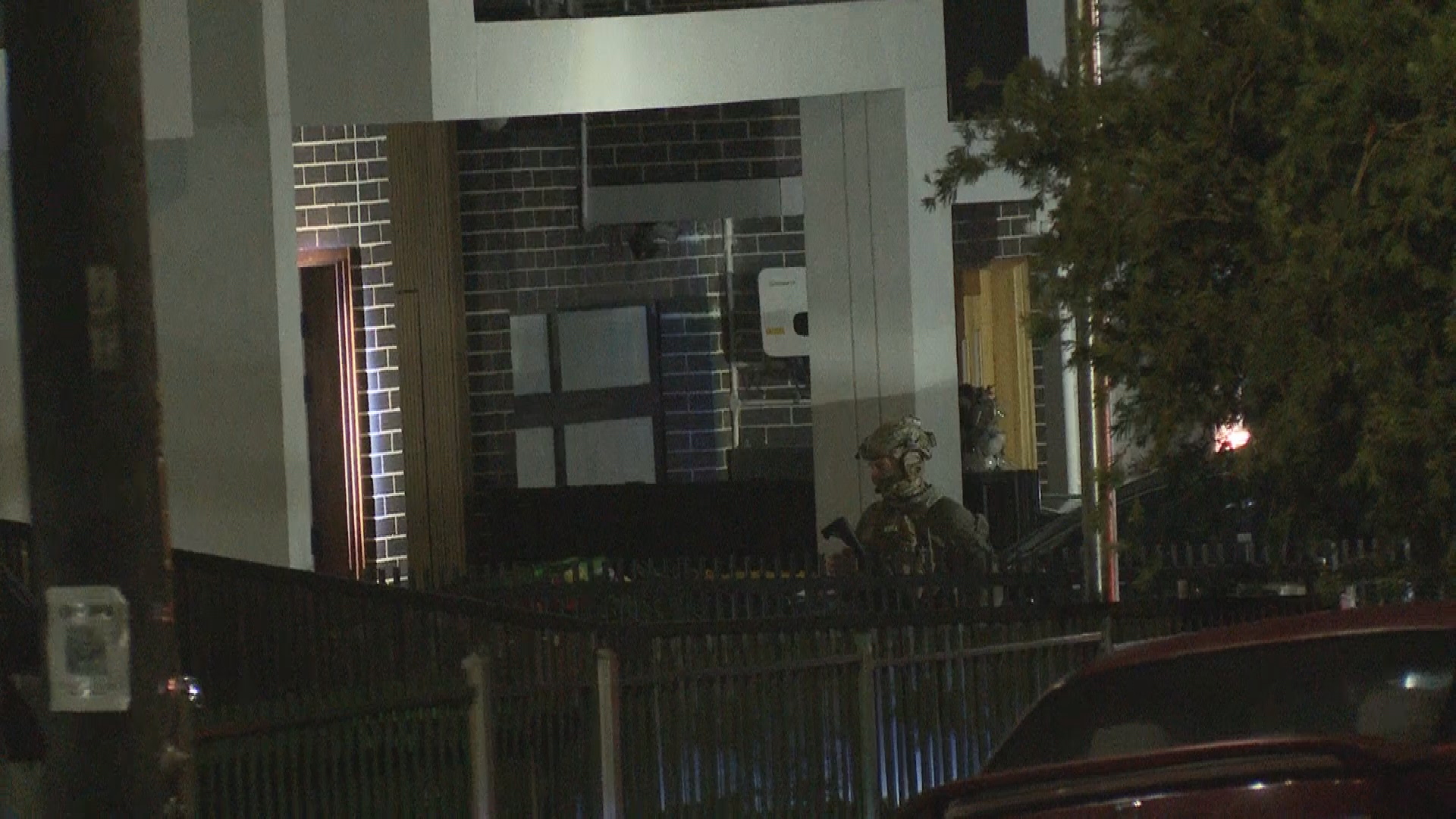 Tactical police surround home in Sydney