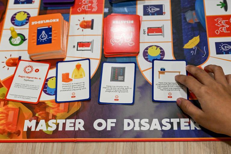 Filipinos master disaster readiness, one roll of the dice at a time