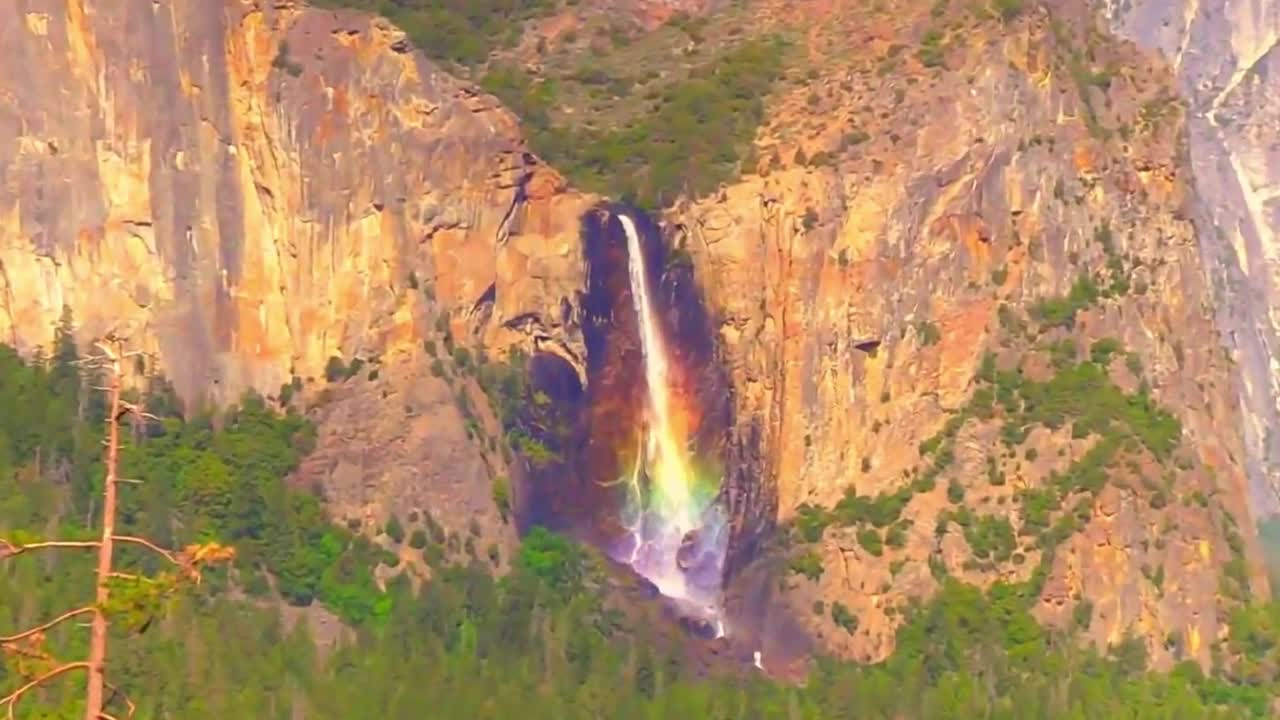 Rainbow waterfall appeared above cliff waterfall in China