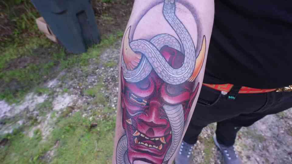 Testing a new snake hook against one of the largest rattlesnakes recorded