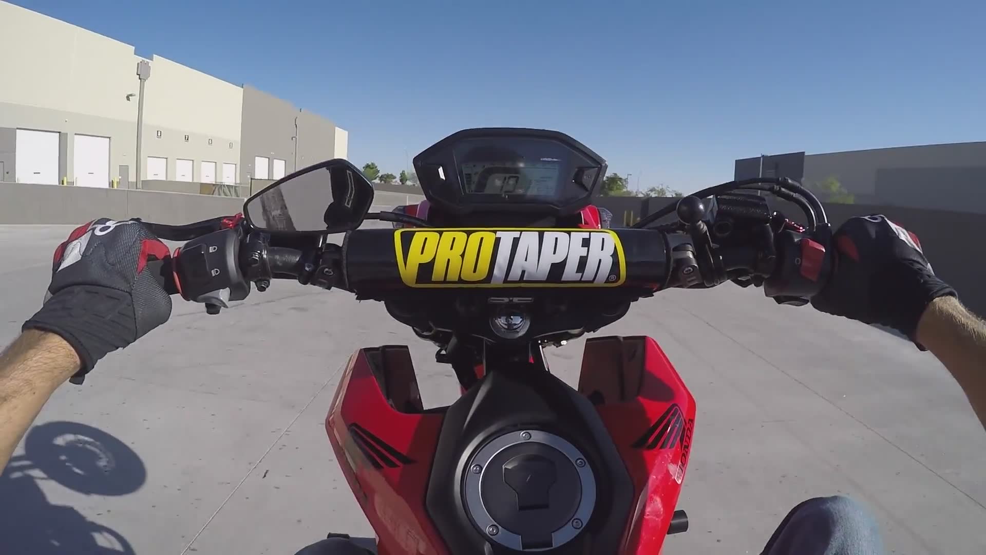 Mini motorcycle wheelie practice results in another tumble