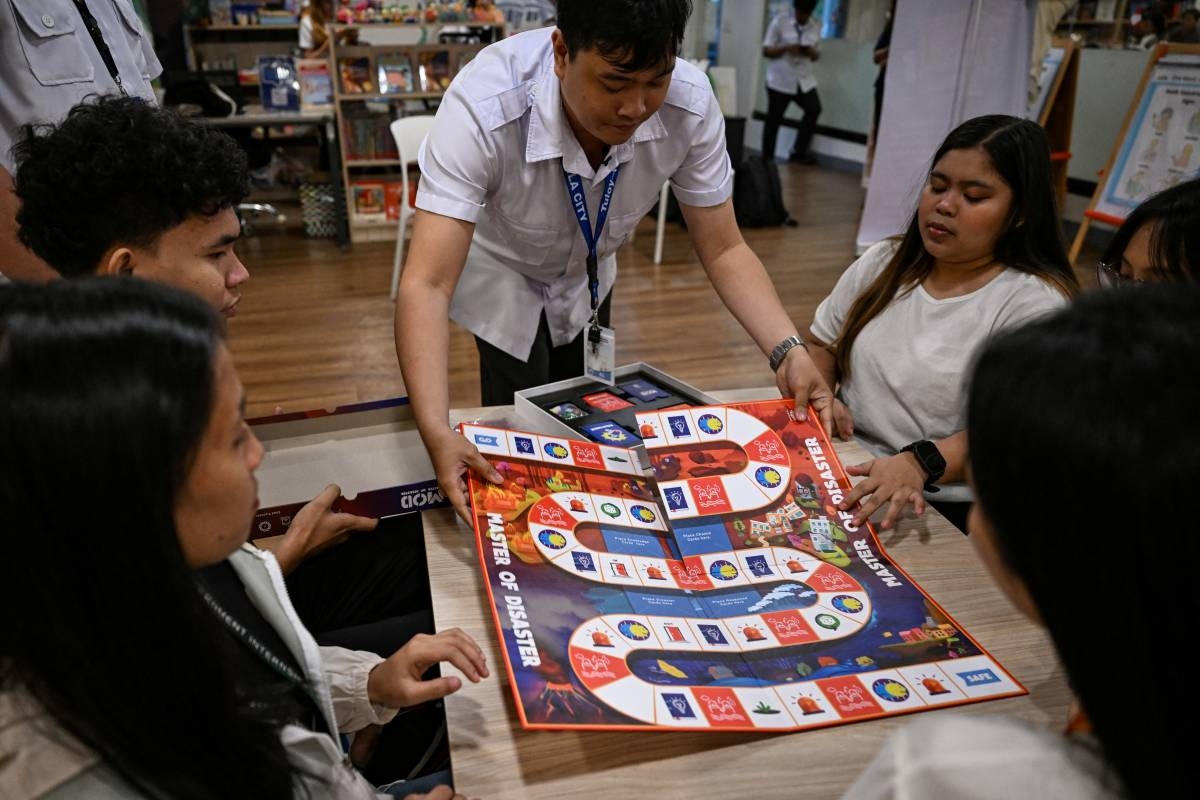 Filipinos master disaster readiness, one roll of the dice at a time