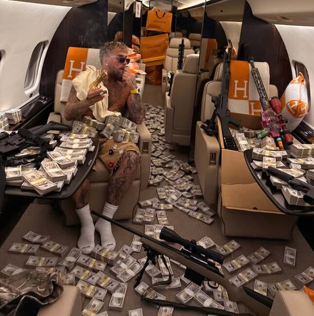 Jake Paul shows off cash, guns in private jet after TKO loss