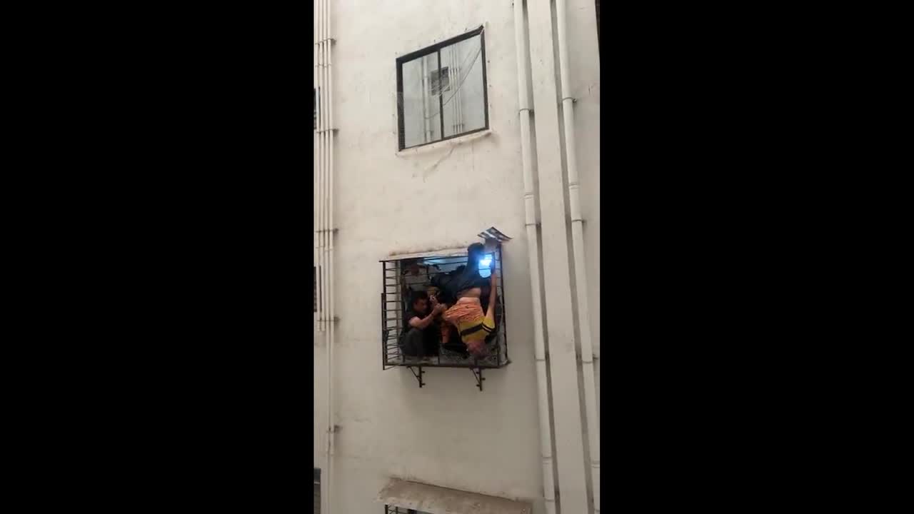 Resident napping on 10th floor window ledge falls off but lands on ...