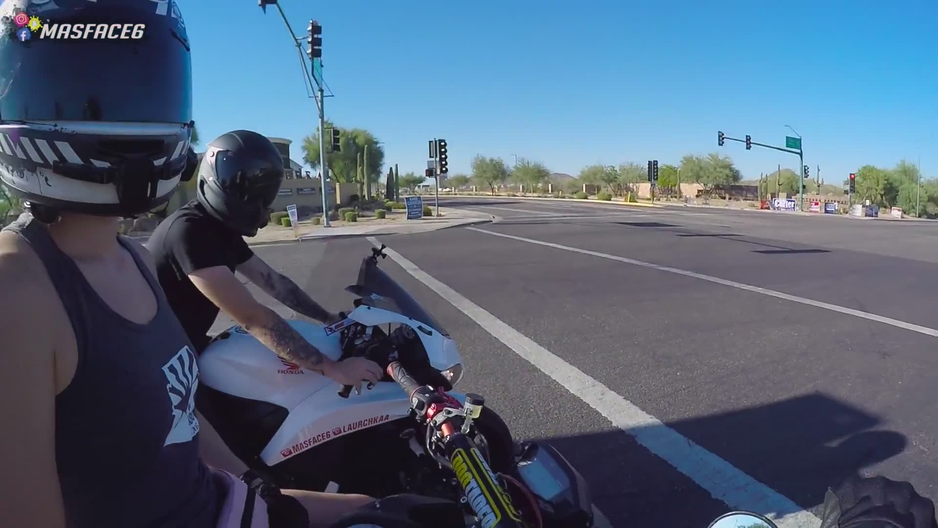 Parking lot entertainment at electronics store on sport bikes