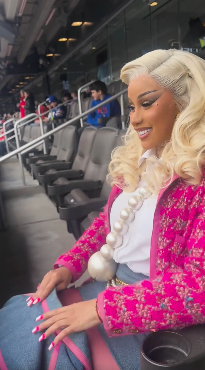 Cardi B and Stefon Diggs coordinate in archival Chanel at an NFL game
