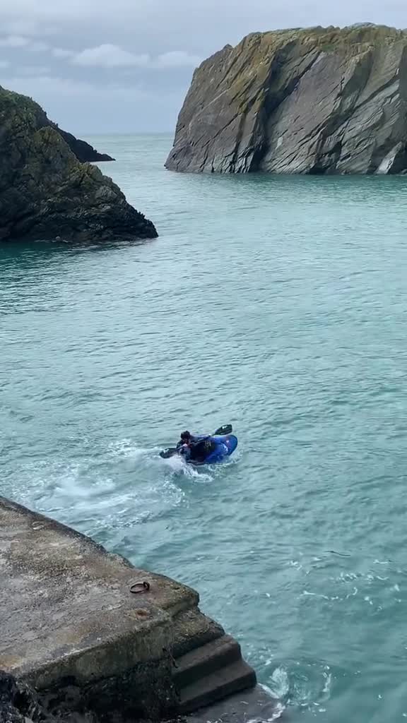 Freestyle kayak tricks in a hidden sea cove