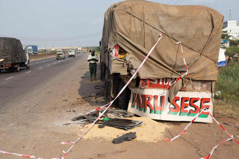 Boxing champ pulled from crash that kills two close friends